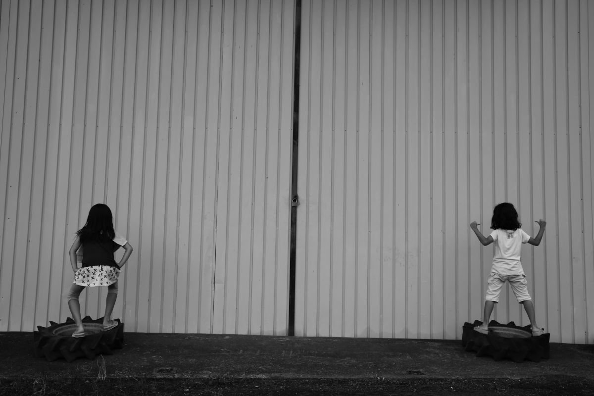 two girls in front of the gate... | GANREF